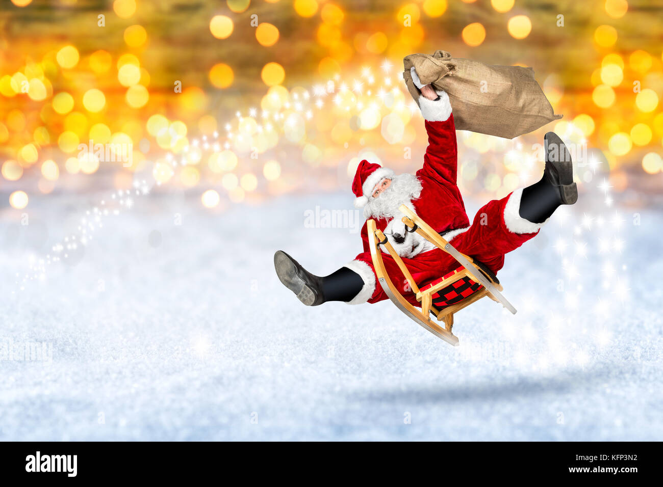 crazy santa claus flying on his sleigh with bag of presents in front of ...