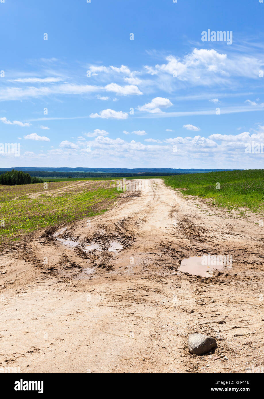 sandy road puddle Stock Photo - Alamy