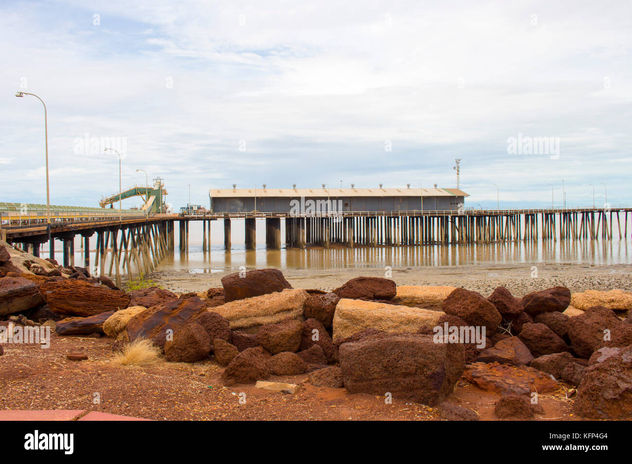 Long jetty with the muddy water ebbing out where King Sound ends in ...