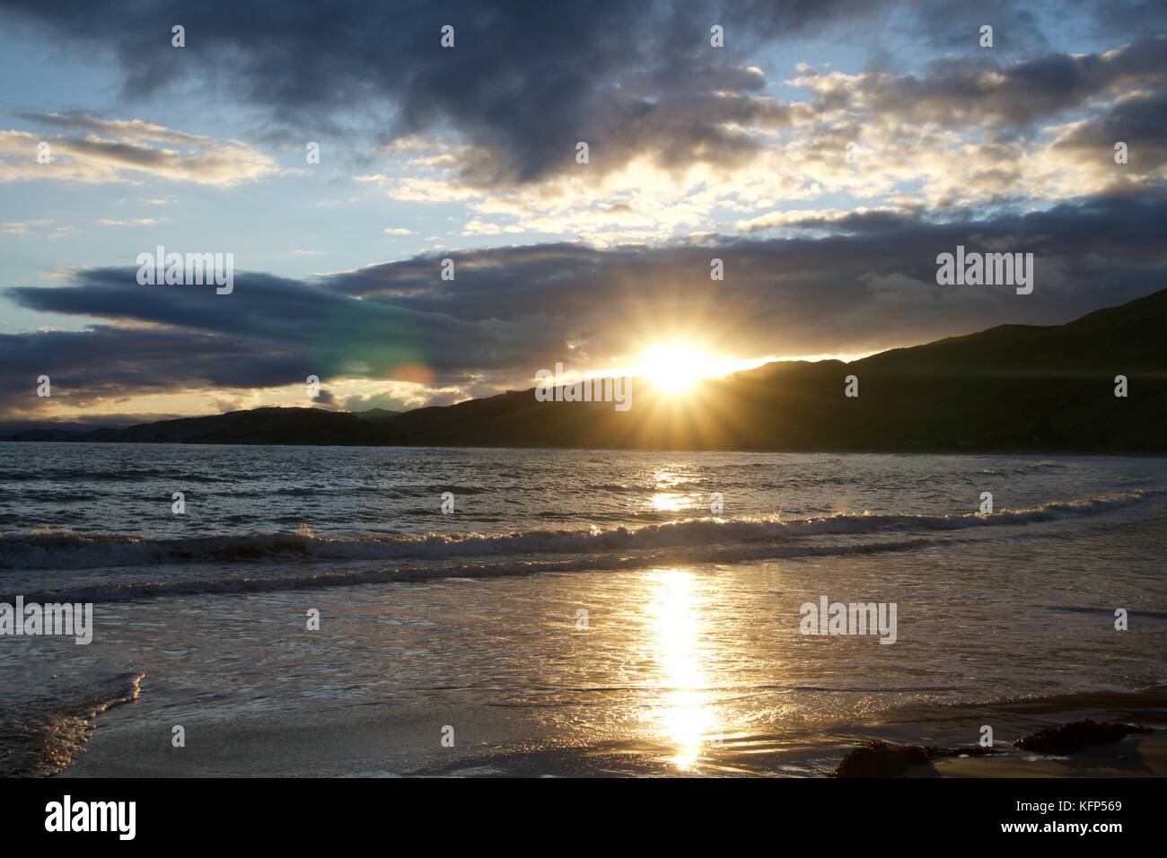 Beach Scene Sunset. Sunset Waves. Sun. Lens-flare Camera Stock Photo ...