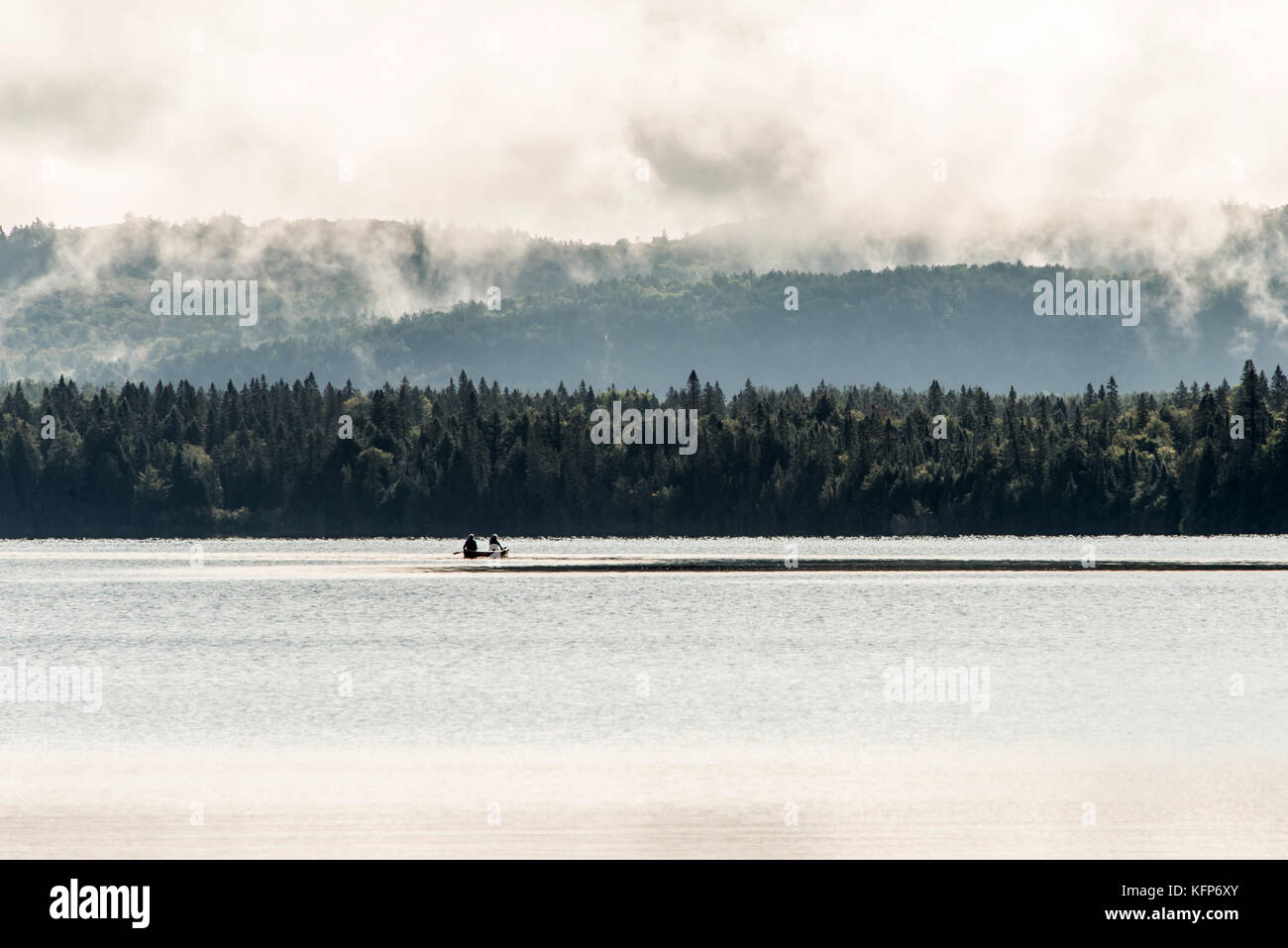 Canoes floating peacefully on the waters of Lake Louise, Banff National ...