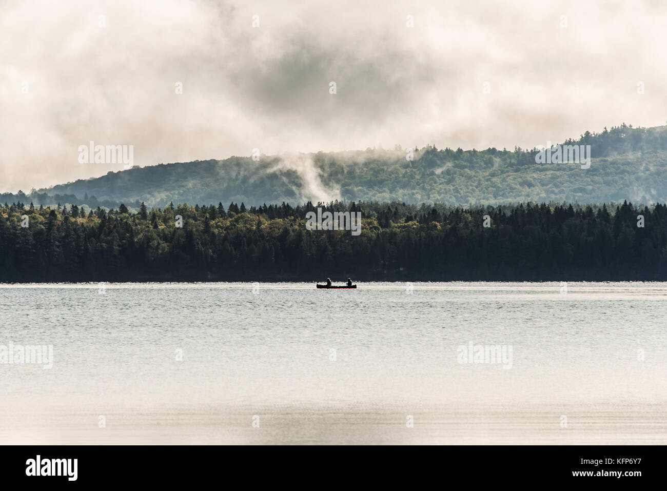 Canoes floating peacefully on the waters of Lake Louise, Banff National ...
