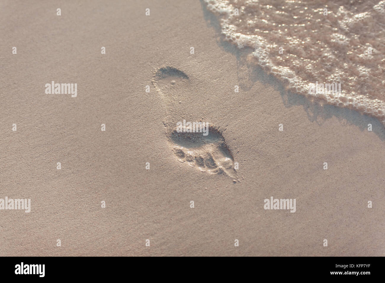 A trace of human foot in the sand. Beach Stock Photo - Alamy