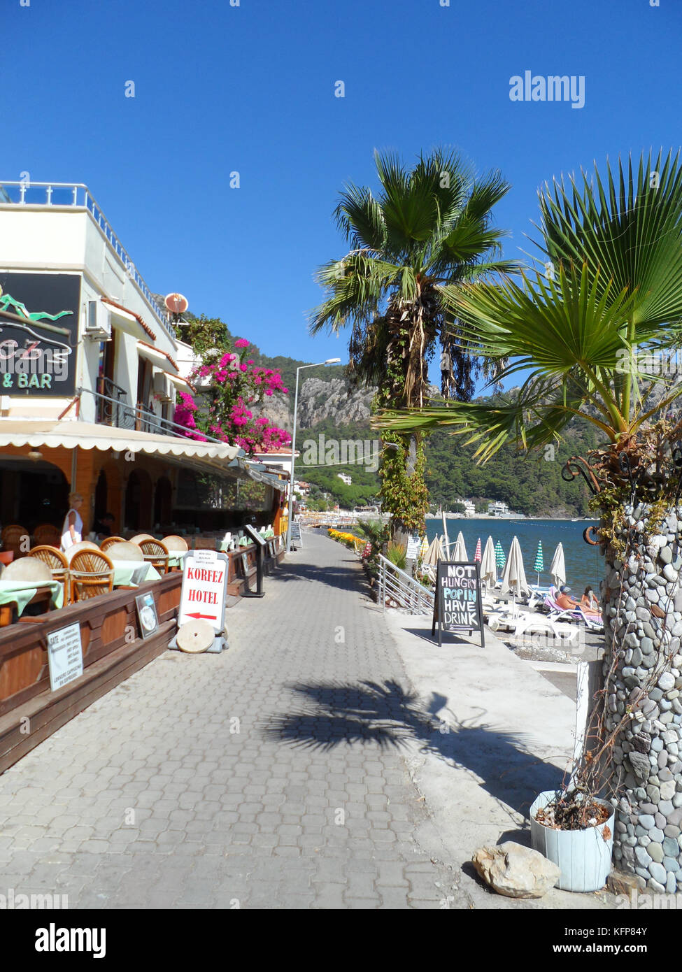 Promenade and hotel bar along the public beach, Turunc, Turkey, Europe ...