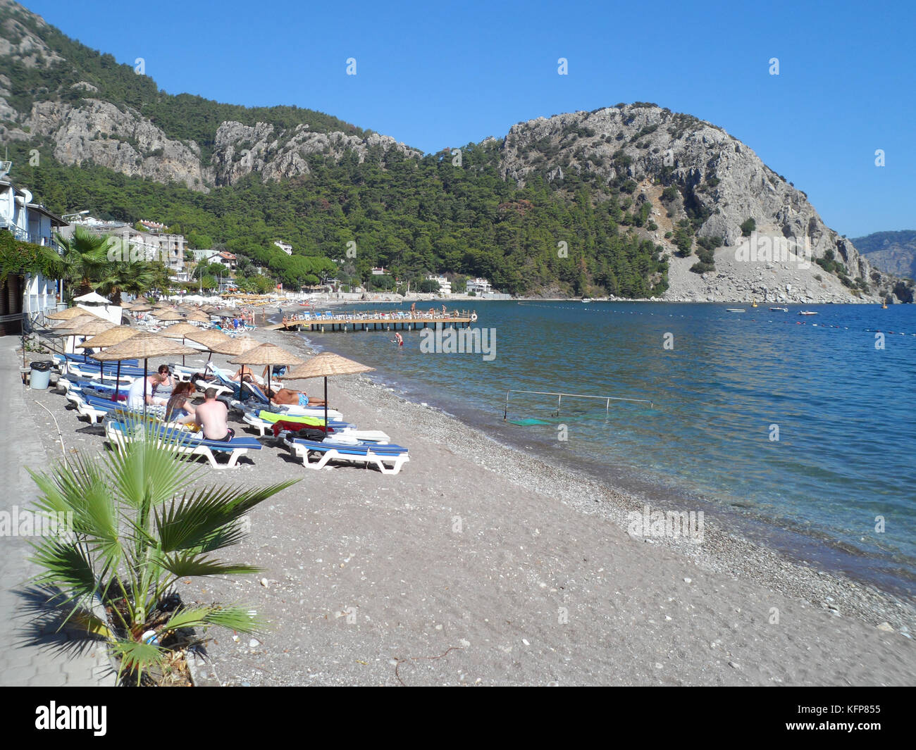 Public beach at the coastal village of Turunc, Turkey, Europe Stock ...