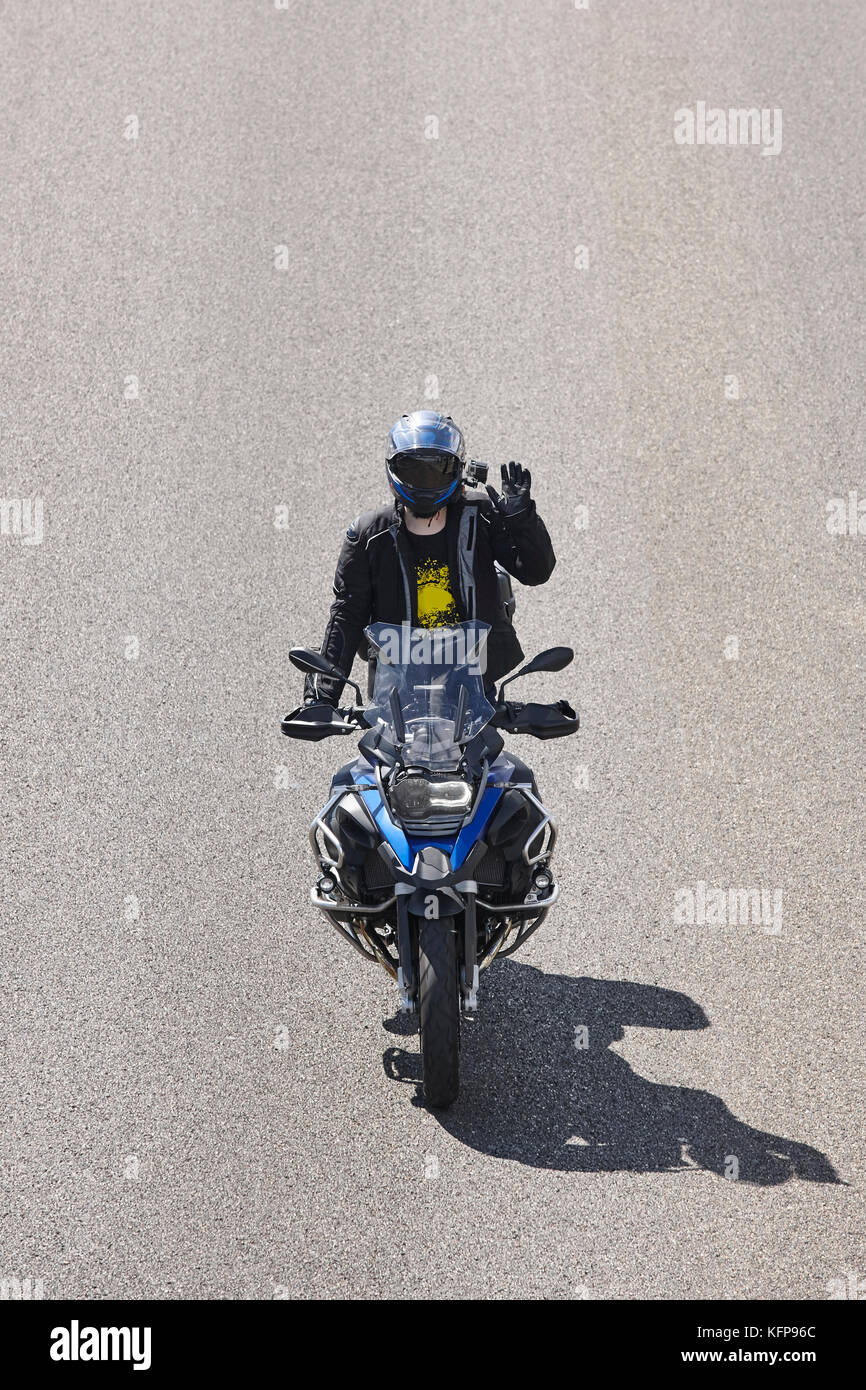 Motorcycle rider on the road. Travel and fun background. Vertical Stock ...