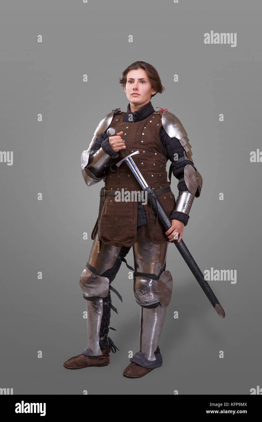 portrait of a medieval female knight in armour with sword isolated over ...