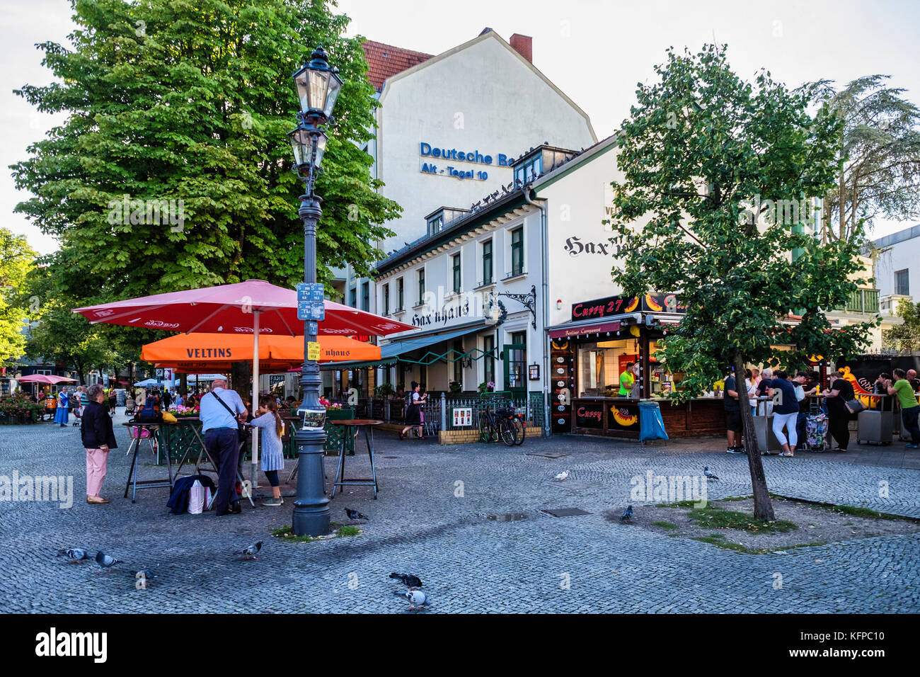 Berlin Alt-Tegel.People enjoy alfresco dining in Pedestrianised street ...