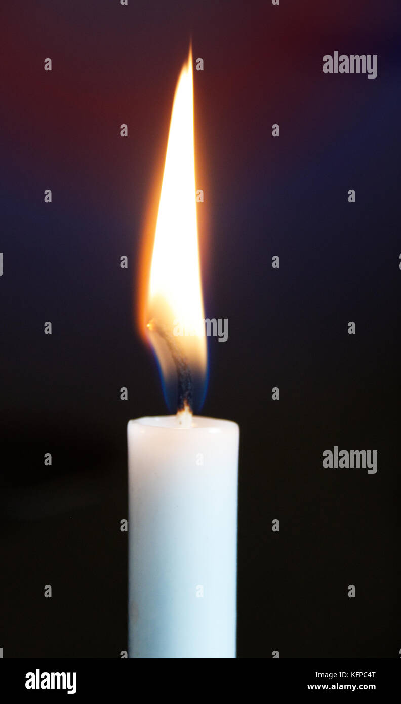 Single burning candle flame Stock Photo - Alamy