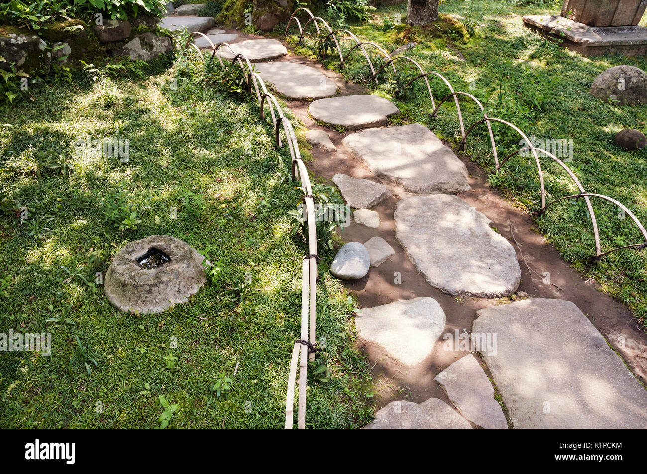 stone steps pathway with small bamboo fence in Japanese zen garden ...