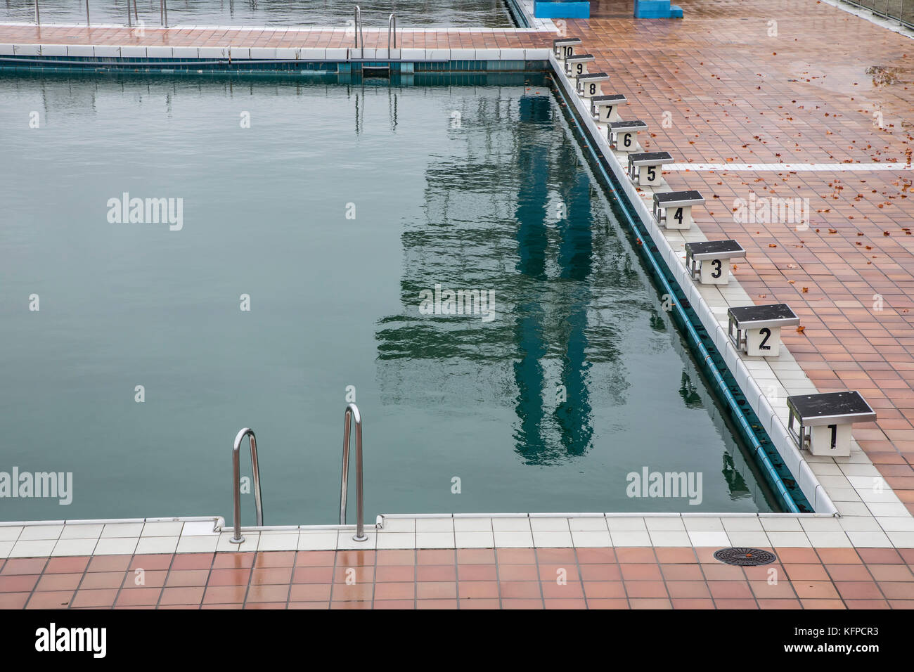 Public swimming pool, closed for the season, in fall, starting block ...
