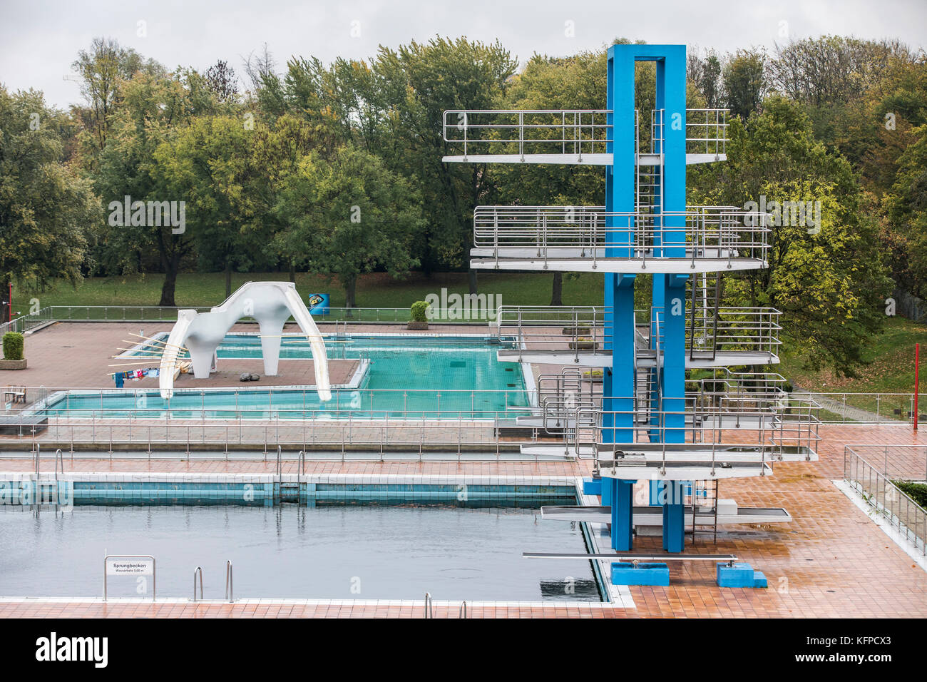 Public swimming pool, closed for the season, in fall, diving platform ...