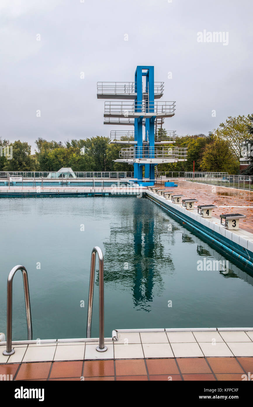 Public swimming pool, closed for the season, in fall, diving platform ...