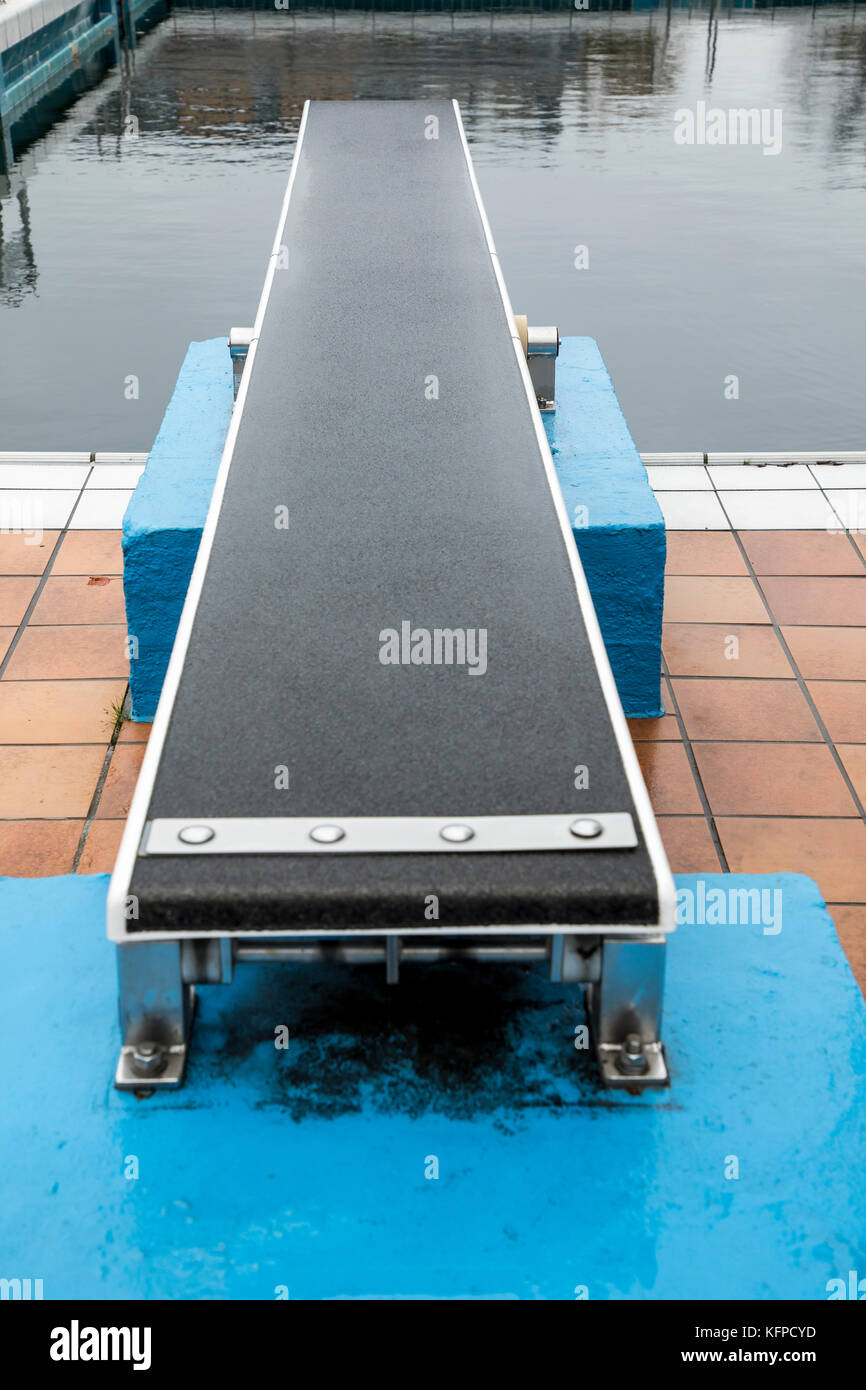 Public swimming pool, closed for the season, in fall, diving platform ...