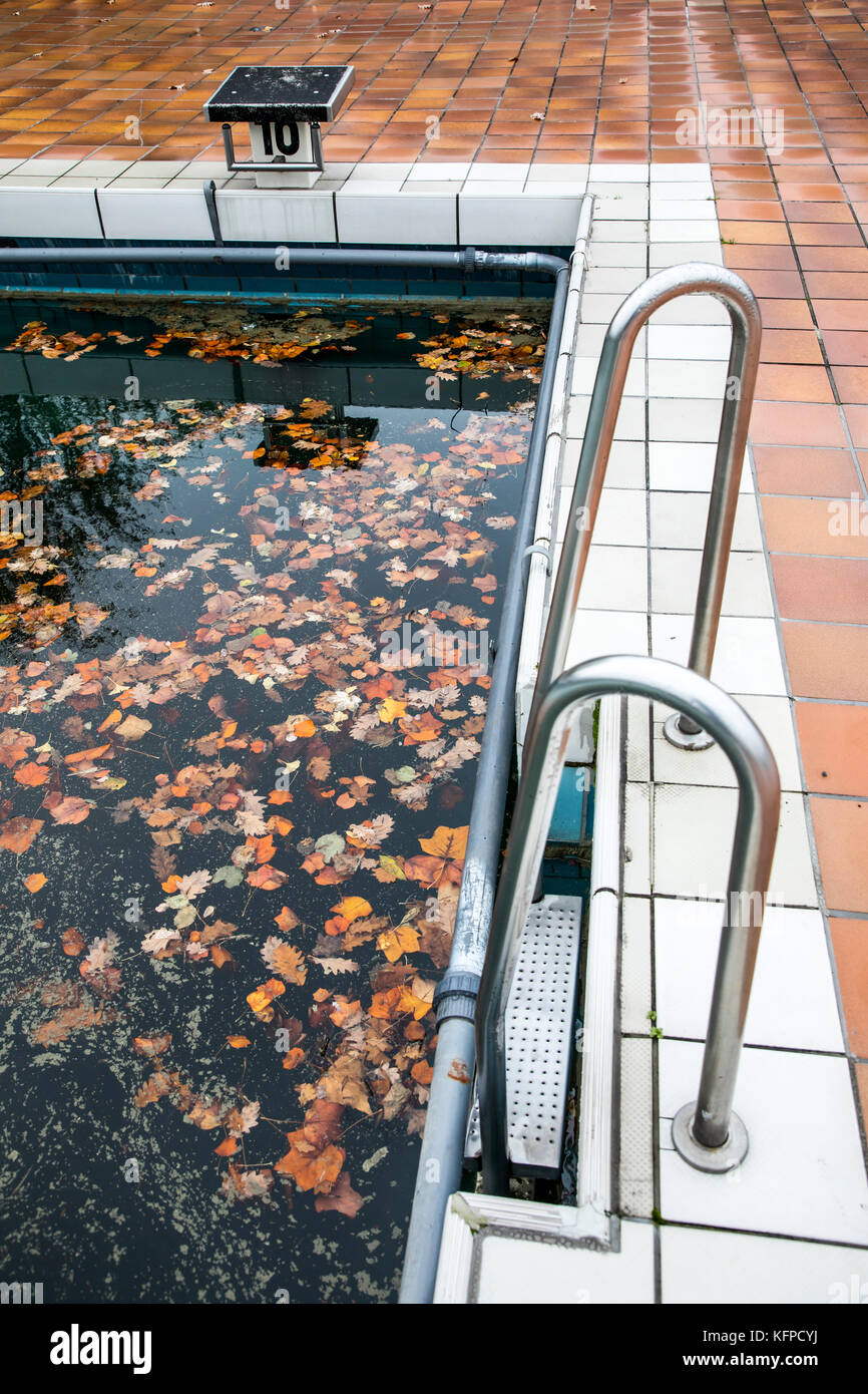 Public swimming pool, closed for the season, in fall, diving platform ...