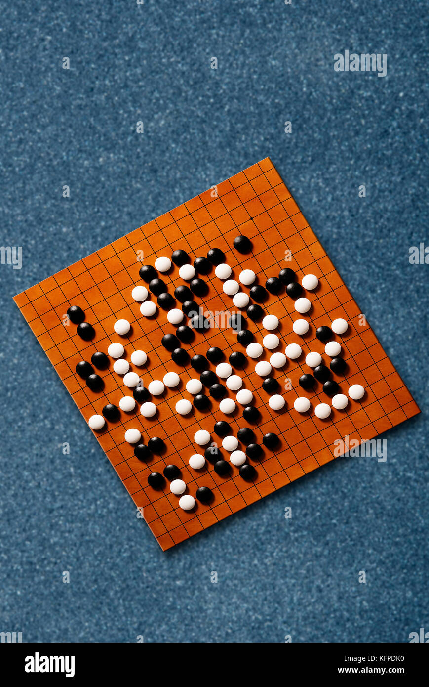 Goban with a Go game in progress, view from above Stock Photo - Alamy