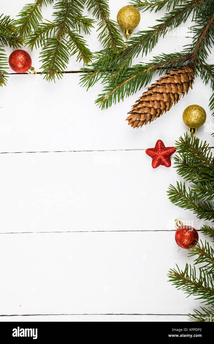 Spruce branch and balls. Christmas still life on a wooden table.Border ...