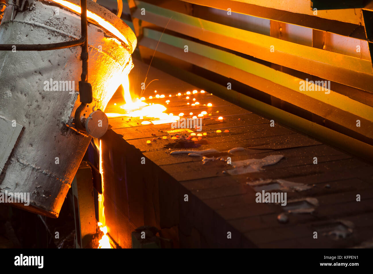 Iron molten metal pouring in sand mold ; green sand process Stock Photo ...