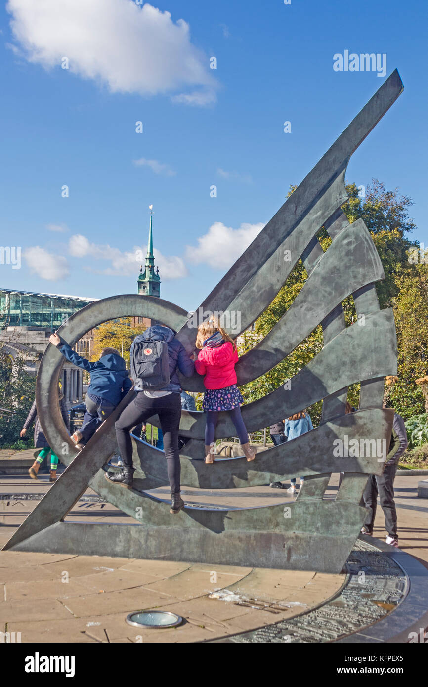 City of London Small children adapting the giant sundial at Tower hill ...