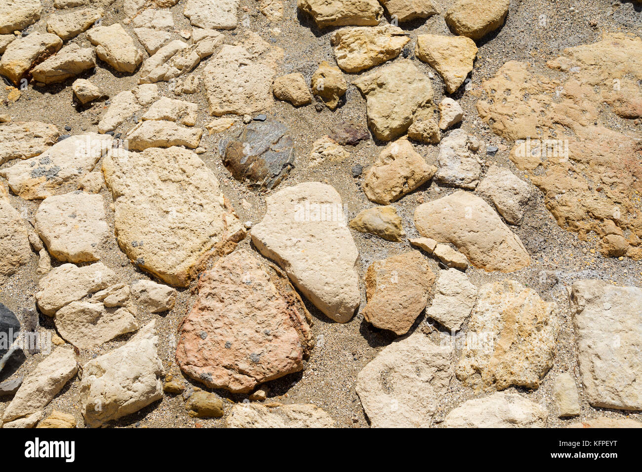 Texture of stone wall from small stones Stock Photo - Alamy