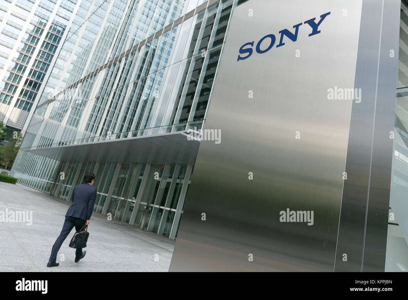 Tokyo, Japan. 31st Oct, 2017. A man walks past a Sony signboard on ...