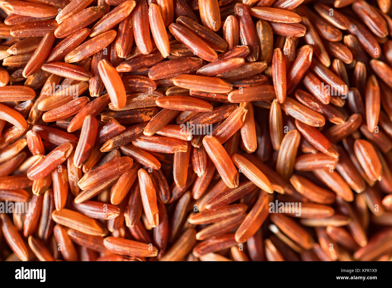 Close-up texture made of natural red rice grains for background Stock ...