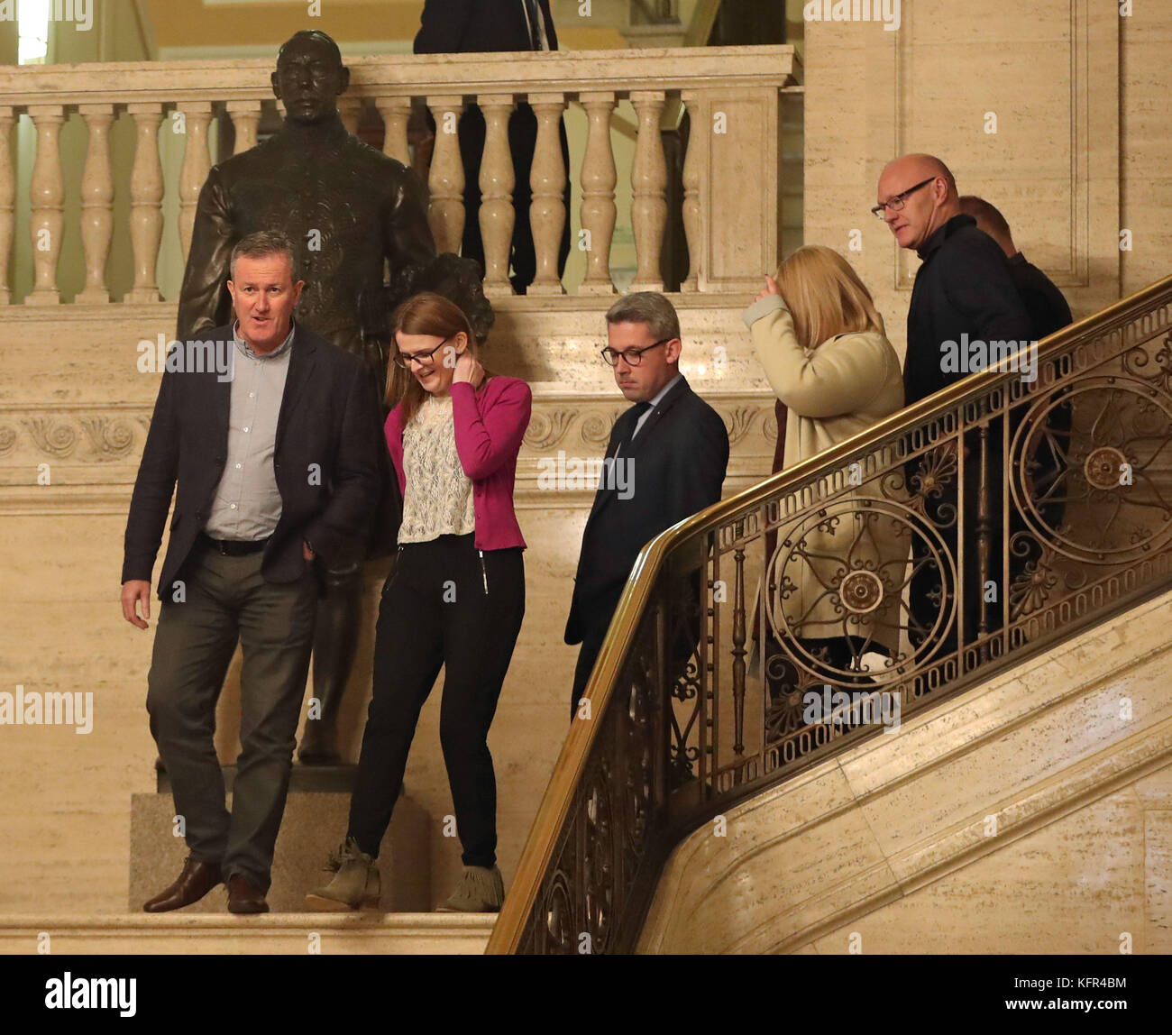 Sinn Fein's Conor Murphy chats with party MLA Caoimhe Archibald before ...