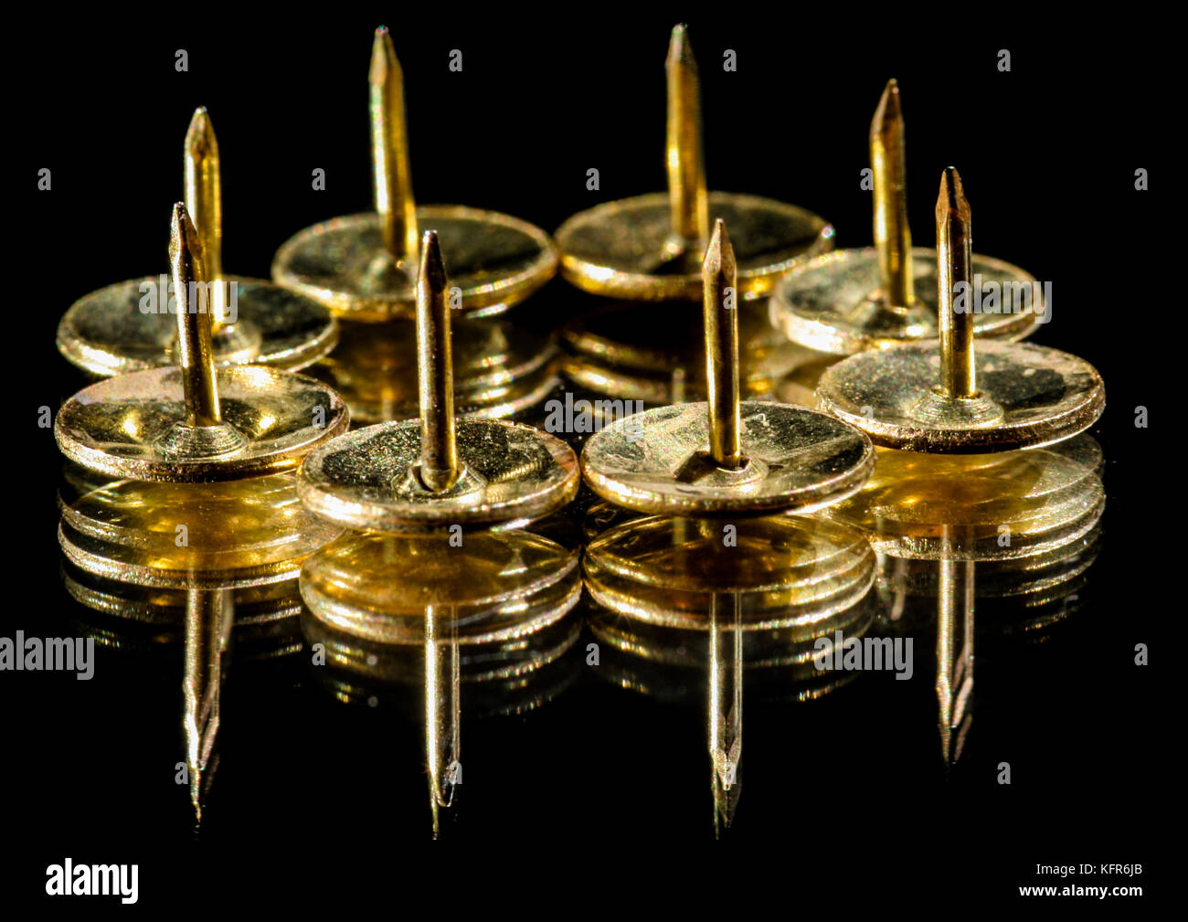 A macro shot of a collection of upturned drawing pins Stock Photo - Alamy