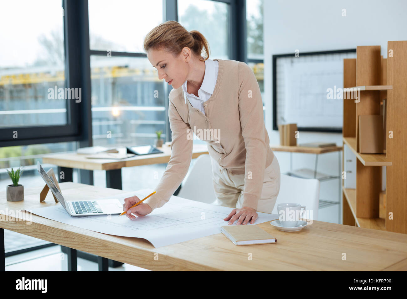 Serious engineer working on new sketch Stock Photo - Alamy