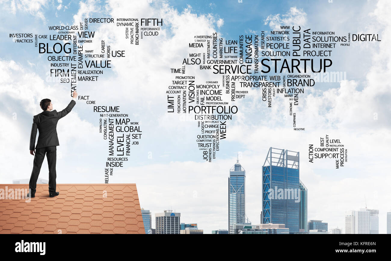 Businessman on brick roof draw world map as concept of globalization ...