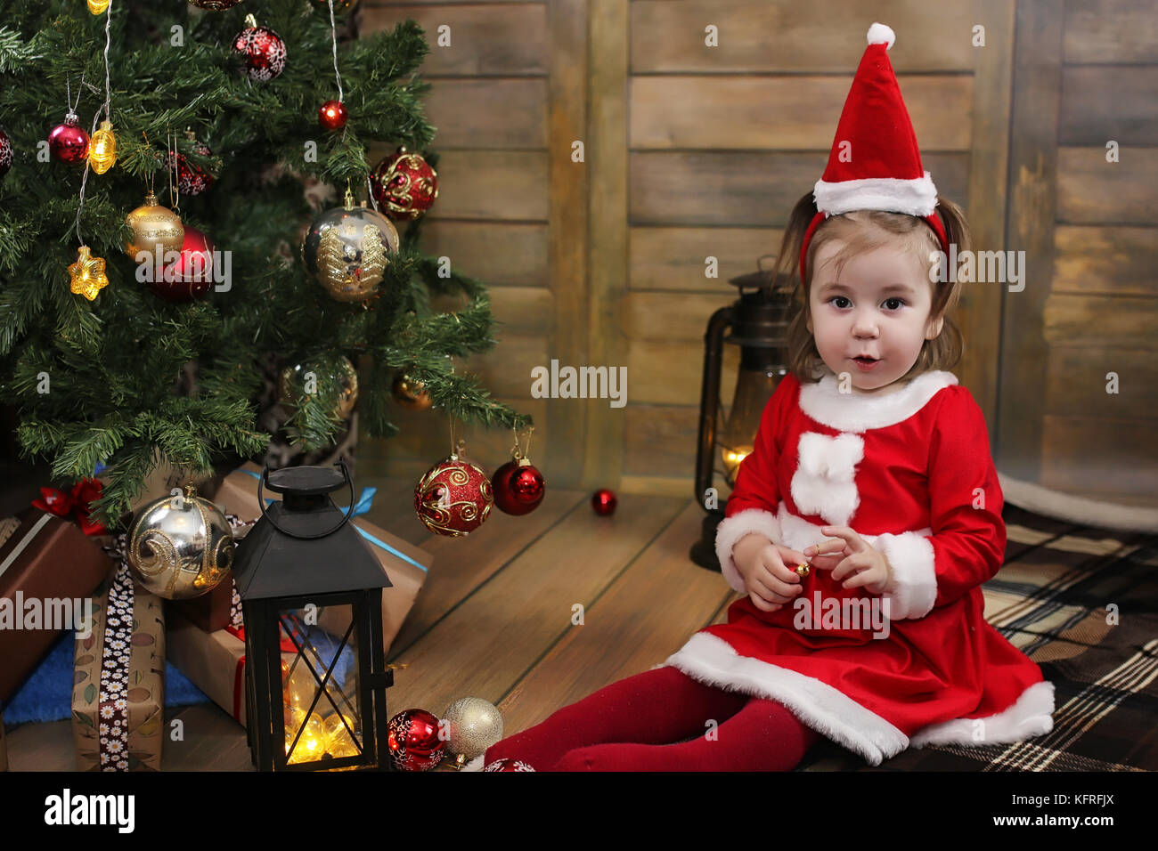 little child and Christmas toys Stock Photo - Alamy