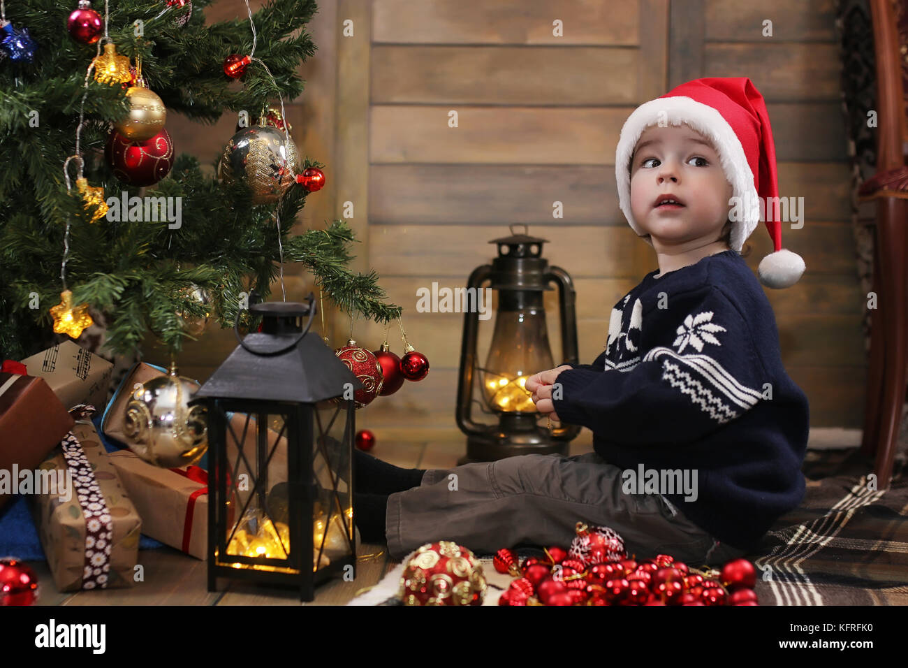 little child and Christmas toys Stock Photo - Alamy