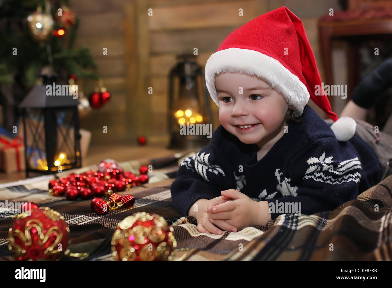 little child and Christmas toys Stock Photo - Alamy