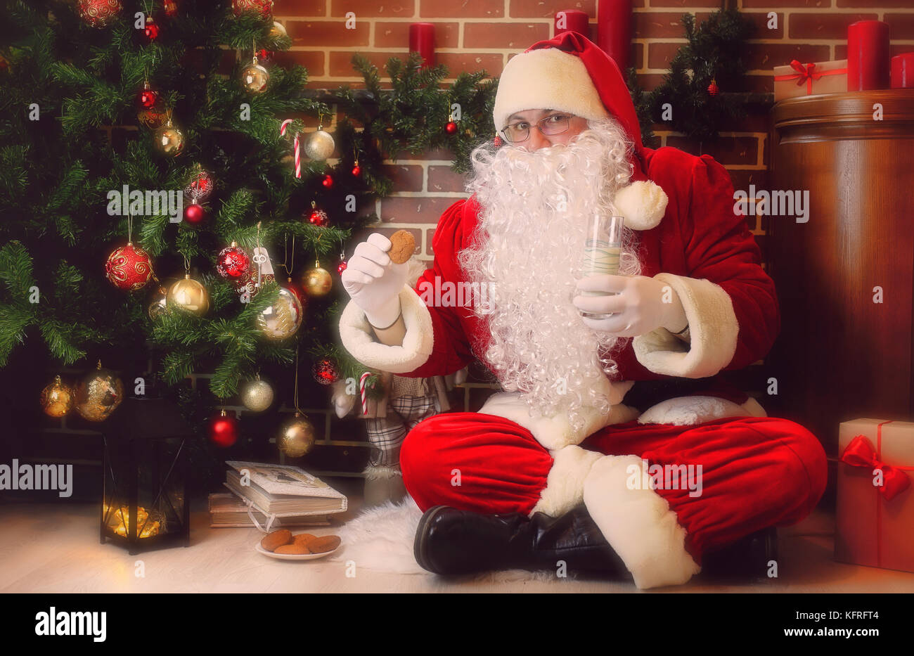 Santa Claus with Christmas tree Stock Photo - Alamy