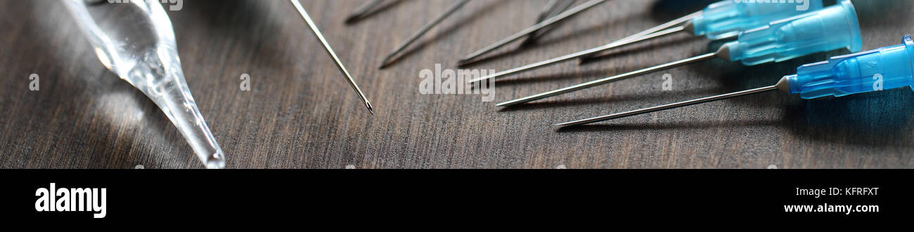 Background with ampoule and needles from a medical syringe Stock Photo ...