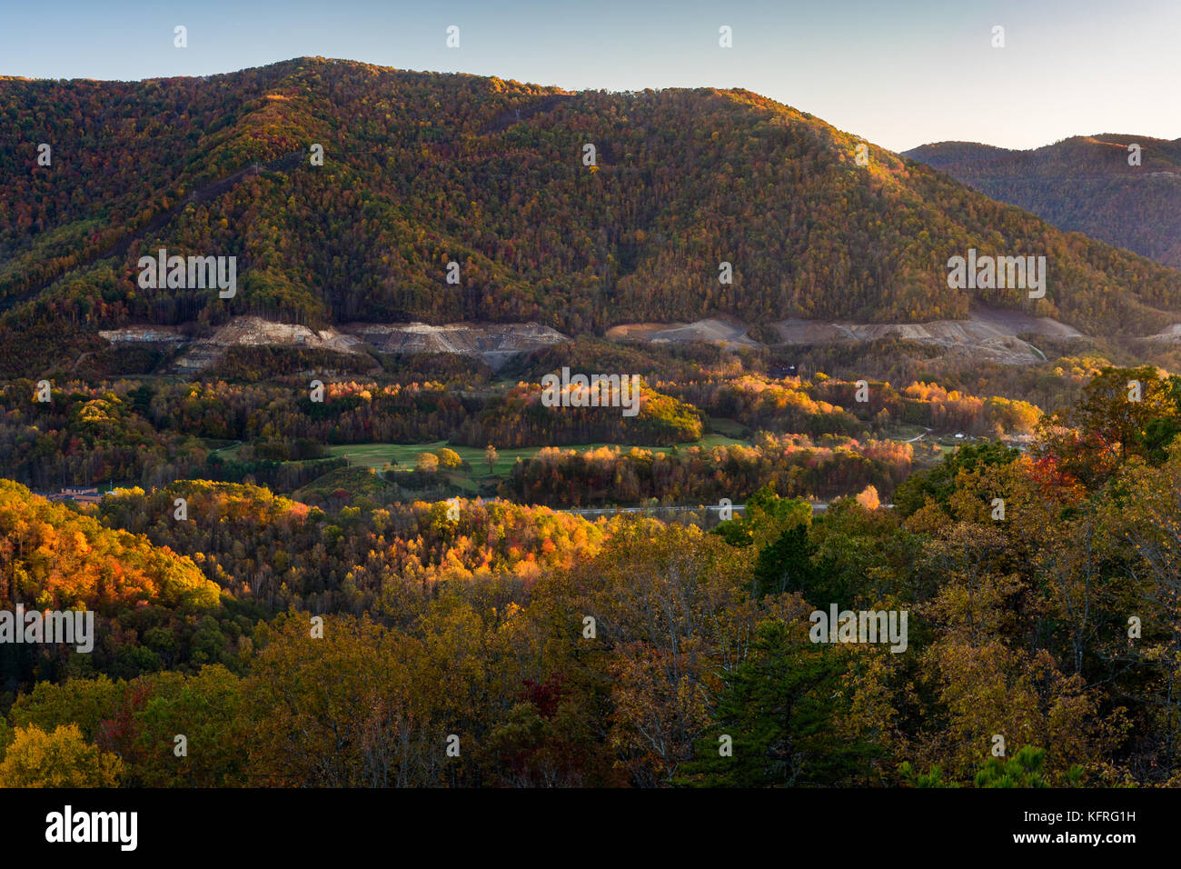 The sun is low in the sky on a mountain during the autumn months Stock ...