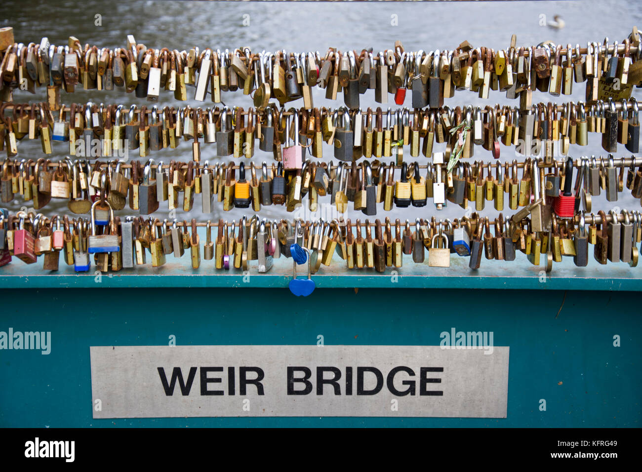 Love locks attached to Weir bridge, over the river Wye, Bakewell ...