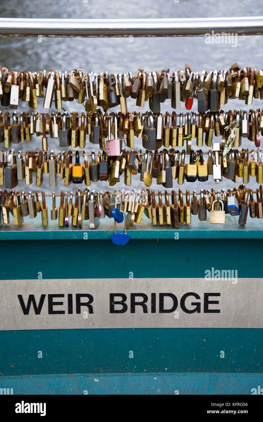 Love locks attached to Weir bridge, over the river Wye, Bakewell ...