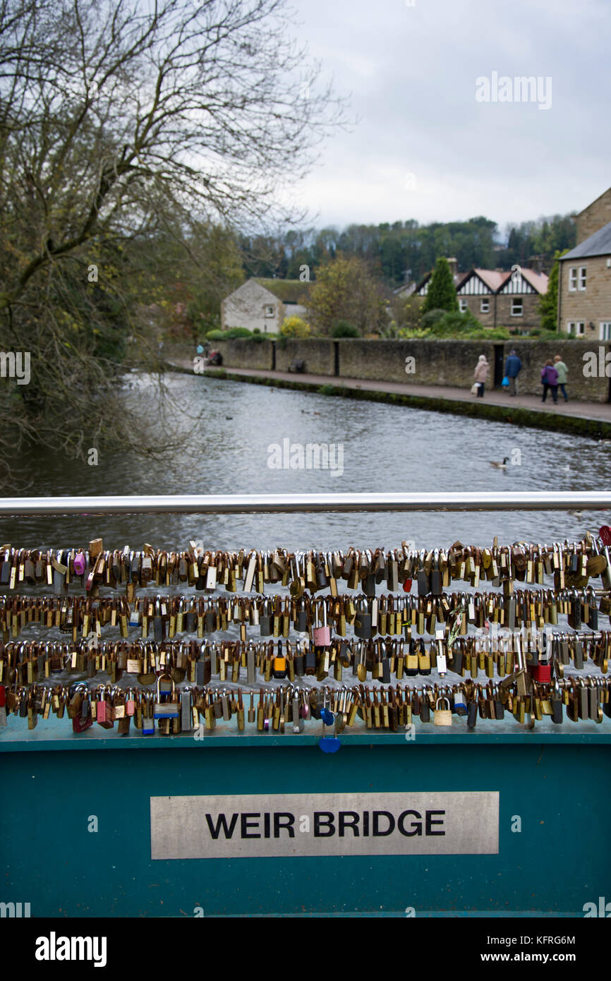Love locks attached to Weir bridge, over the river Wye, Bakewell ...
