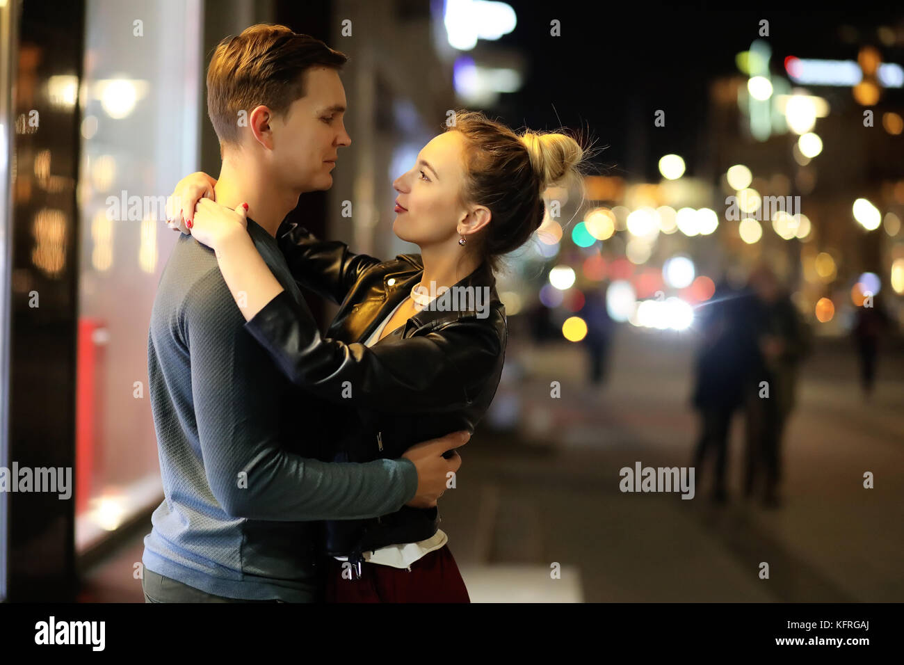 Beautiful couple on a date in a night city Stock Photo - Alamy