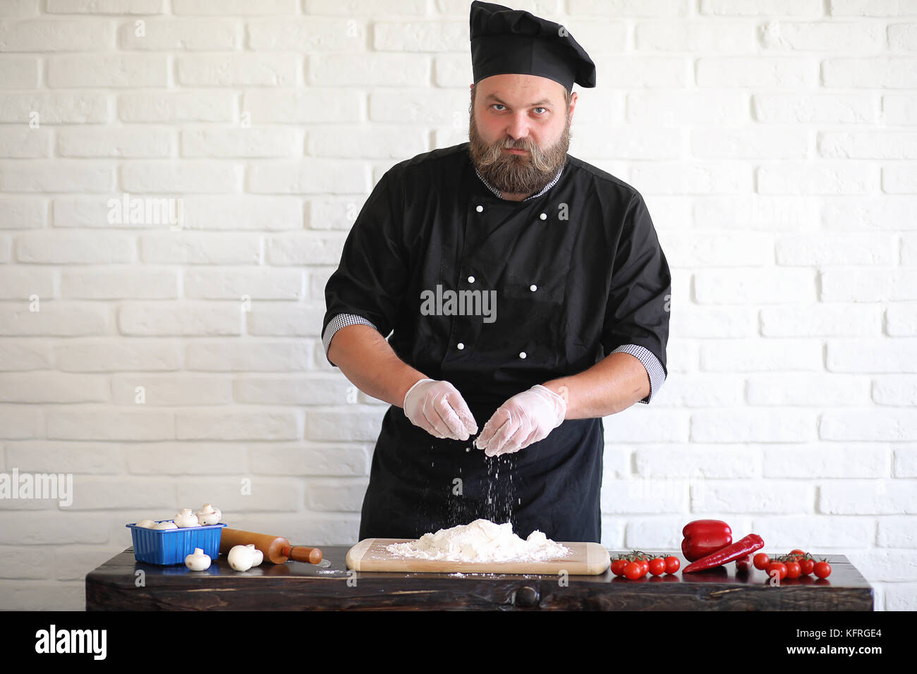 Bearded chef chef prepares meals Stock Photo - Alamy