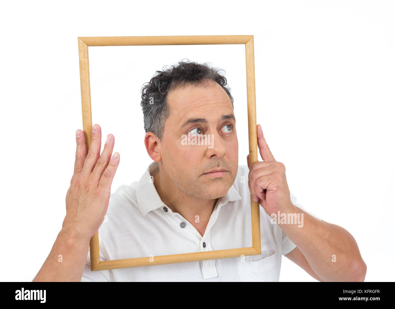 Funny artist is looking through the frame of the picture. Man with ...