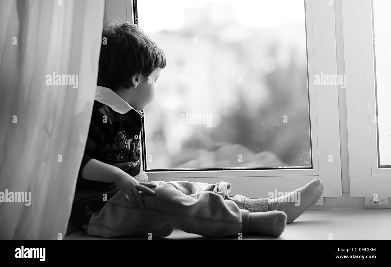 Sad schoolboy looking out hi-res stock photography and images - Alamy
