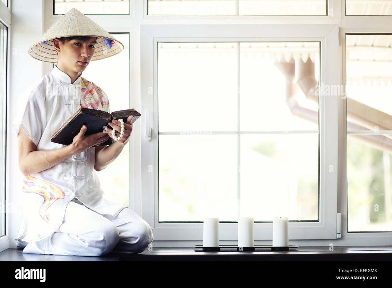 Asian monk reading an old book Stock Photo - Alamy