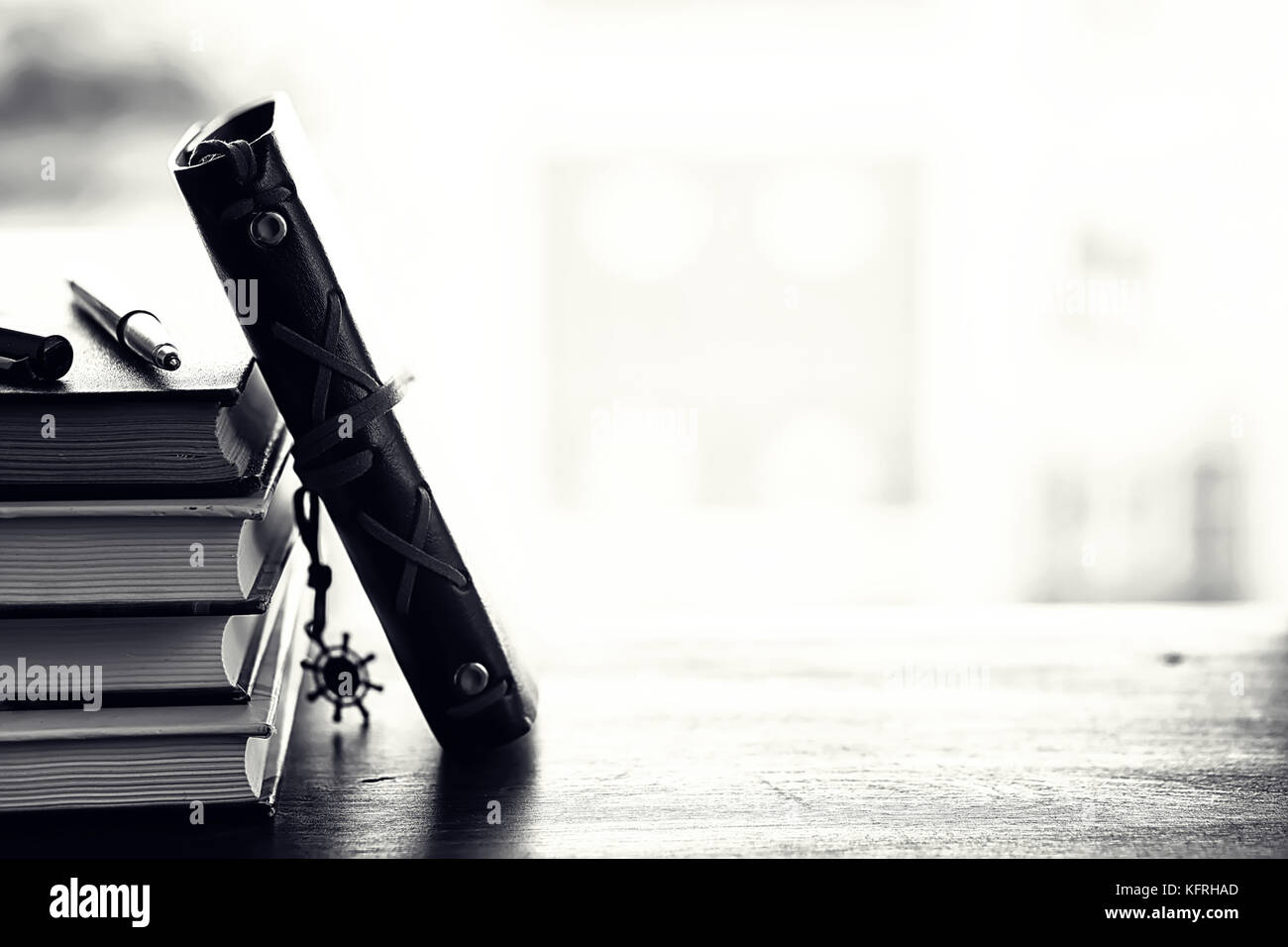 A stack of textbooks on a table Stock Photo - Alamy