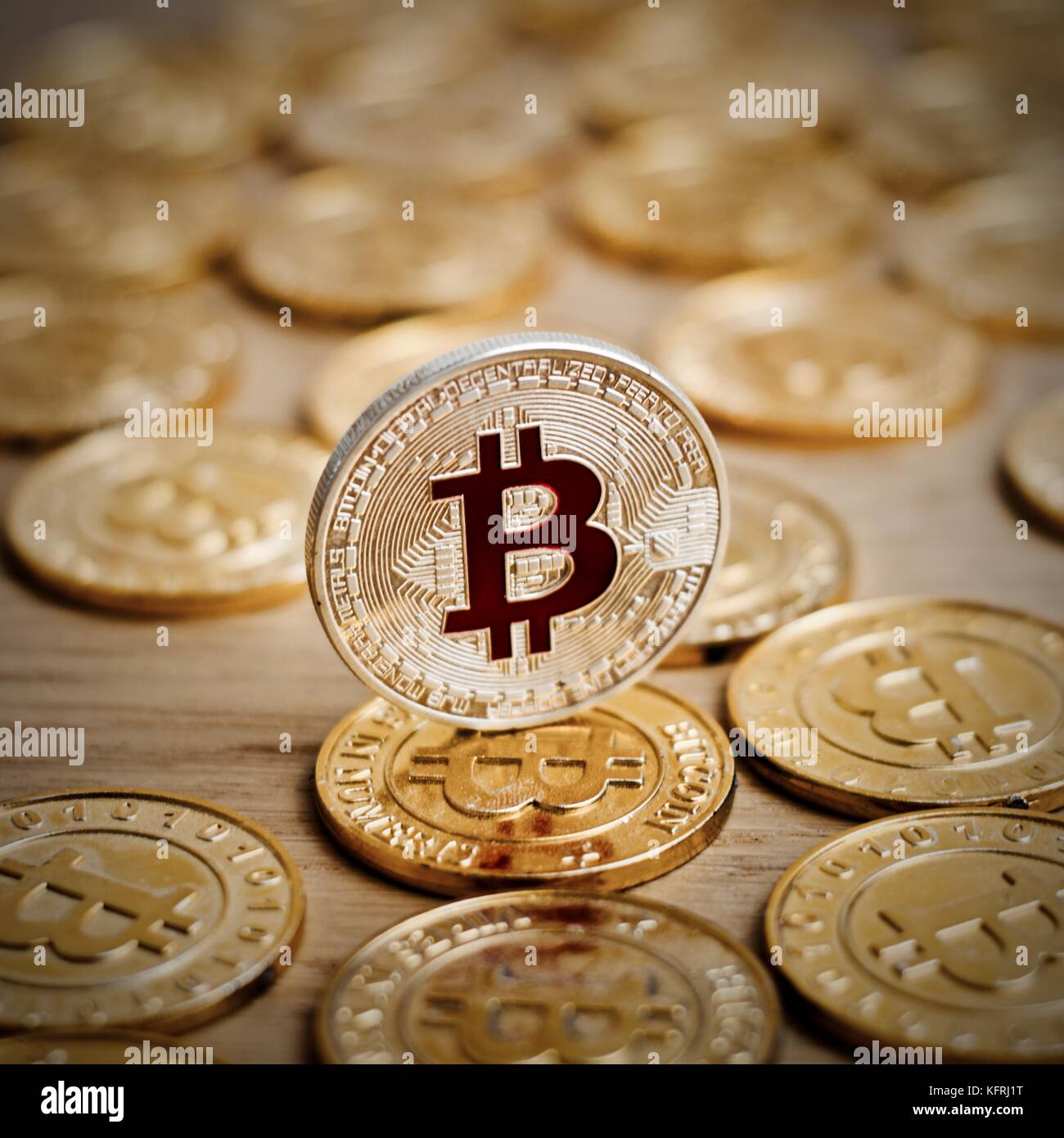 Digital currency physical bitcoin coin. Gold background coins concept ...