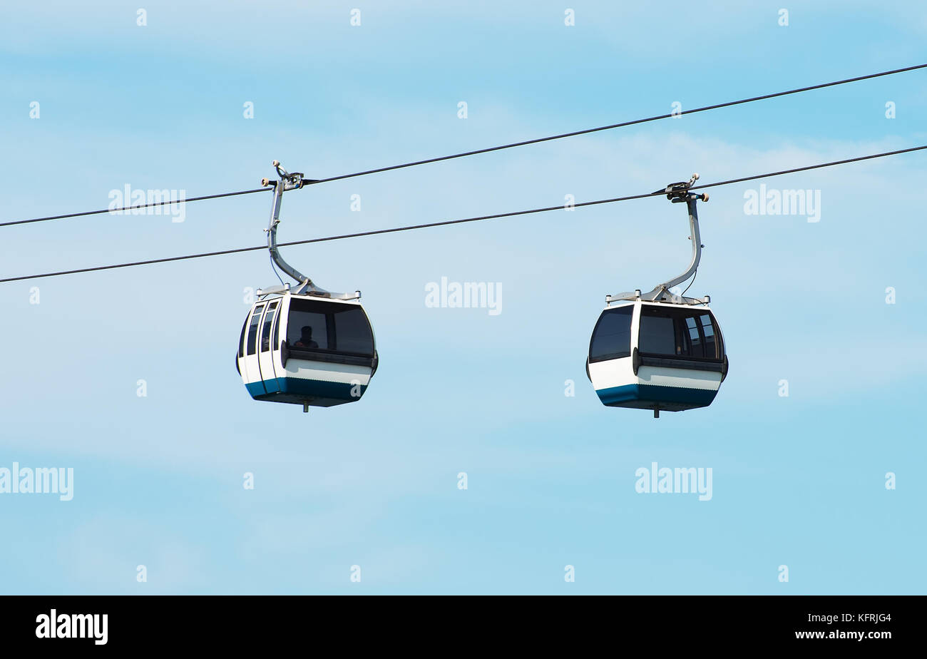 Passenger cable way cabins in the sky Stock Photo - Alamy