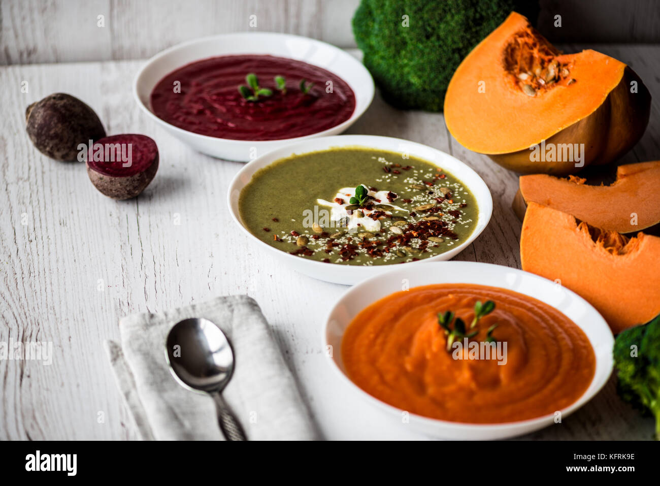Different vegan food. Colorful vegetables cream soups and ingredients ...