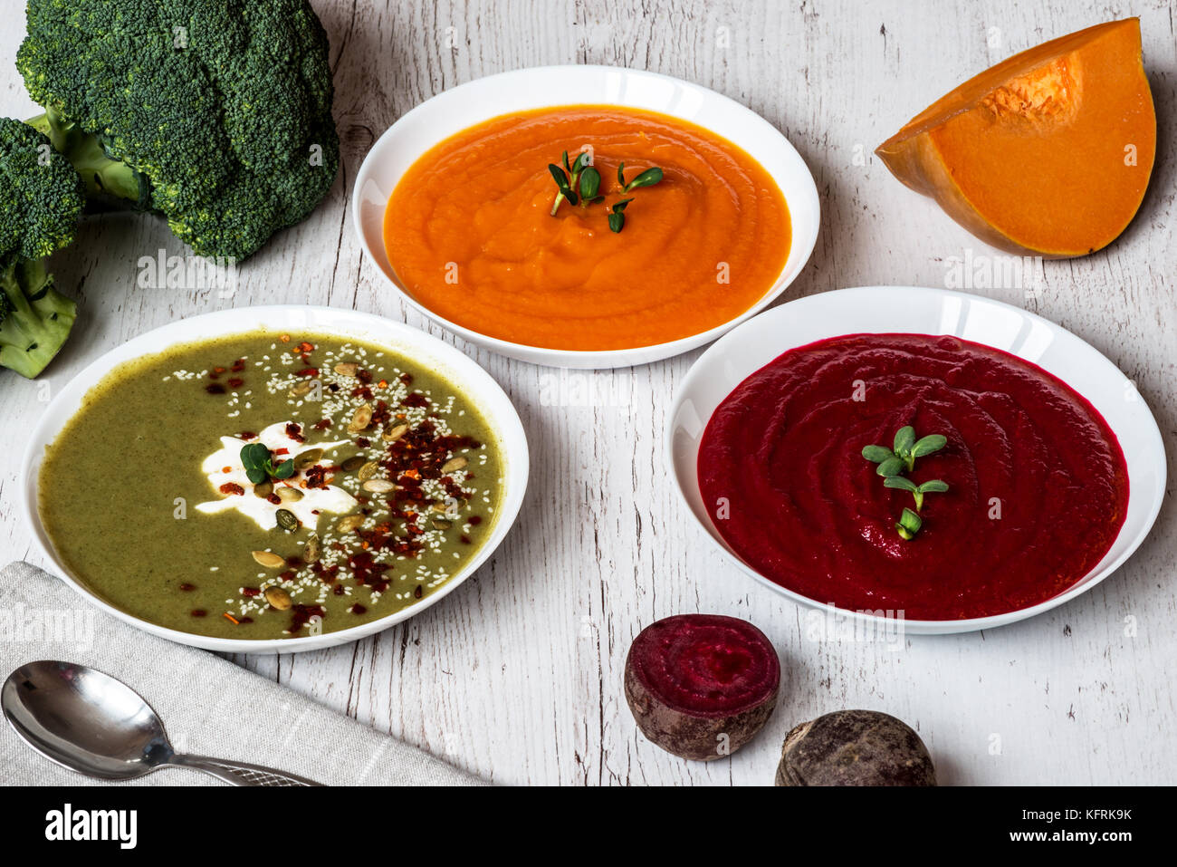 Different vegan food. Colorful vegetables cream soups and ingredients ...