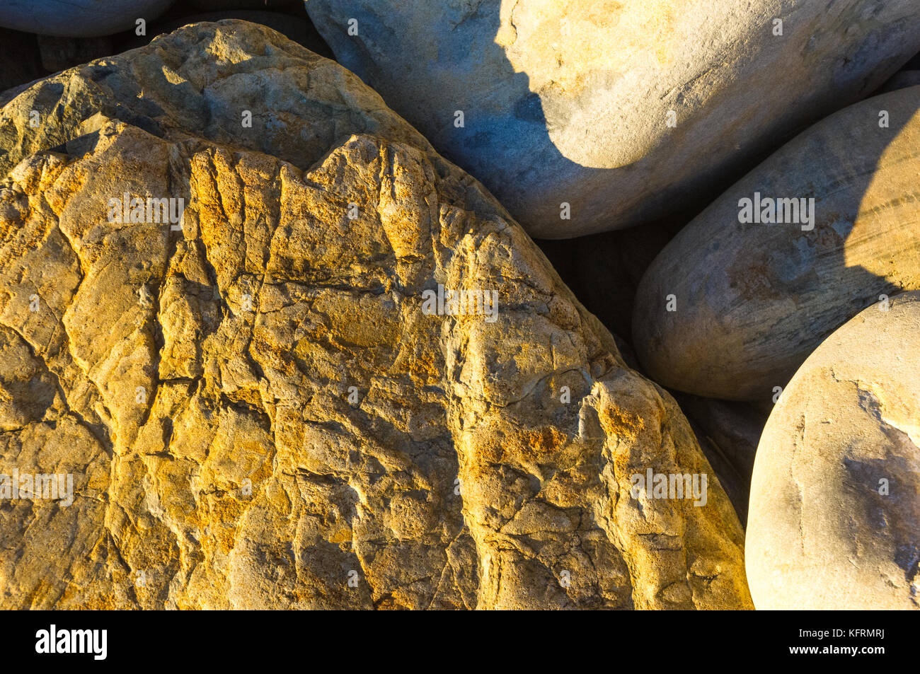boulders and colorful pebbles on the beach on a warm summer day Stock ...